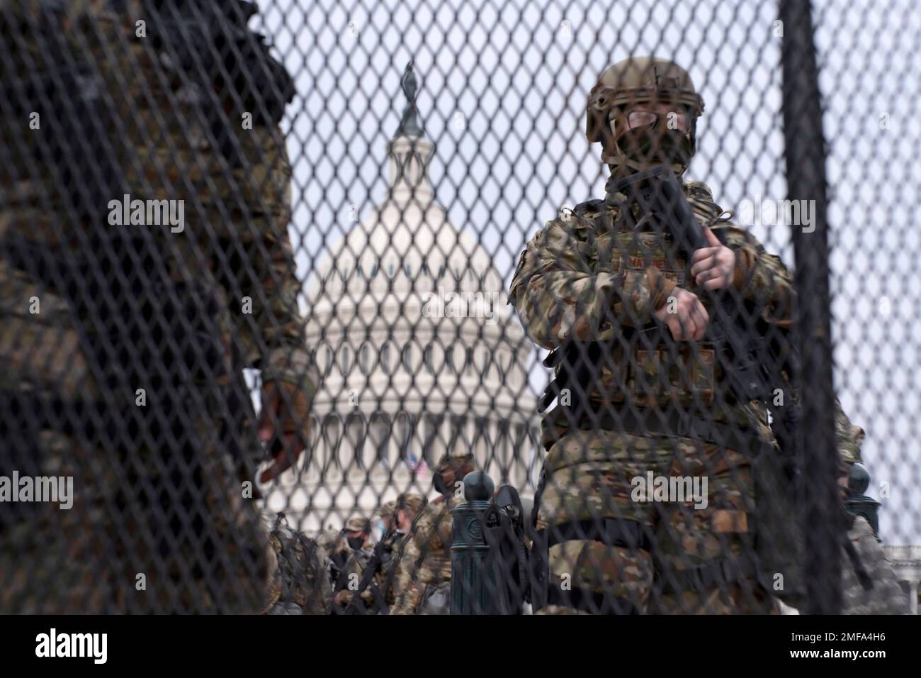 Members of the National Guard stand guard outside the U.S. Capitol in ...