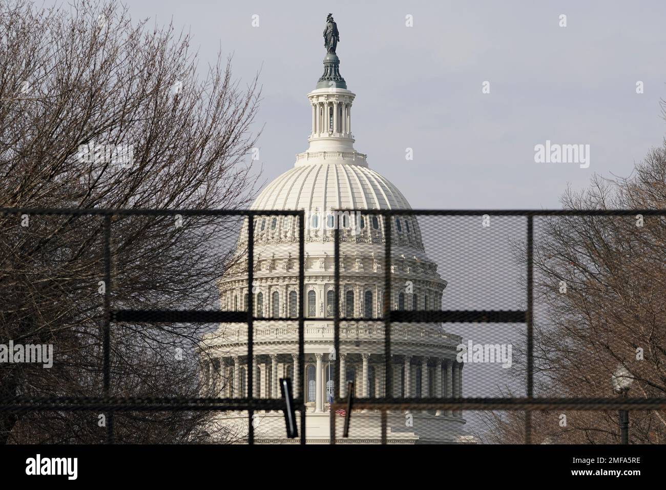 Security surrounds the U.S. Capitol in Washington, Friday, Jan. 15 ...
