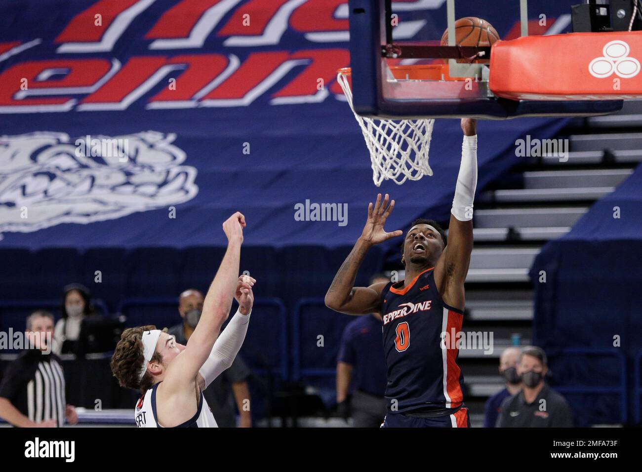 Pepperdine guard Sedrick Altman, right, shoots next to Gonzaga forward ...