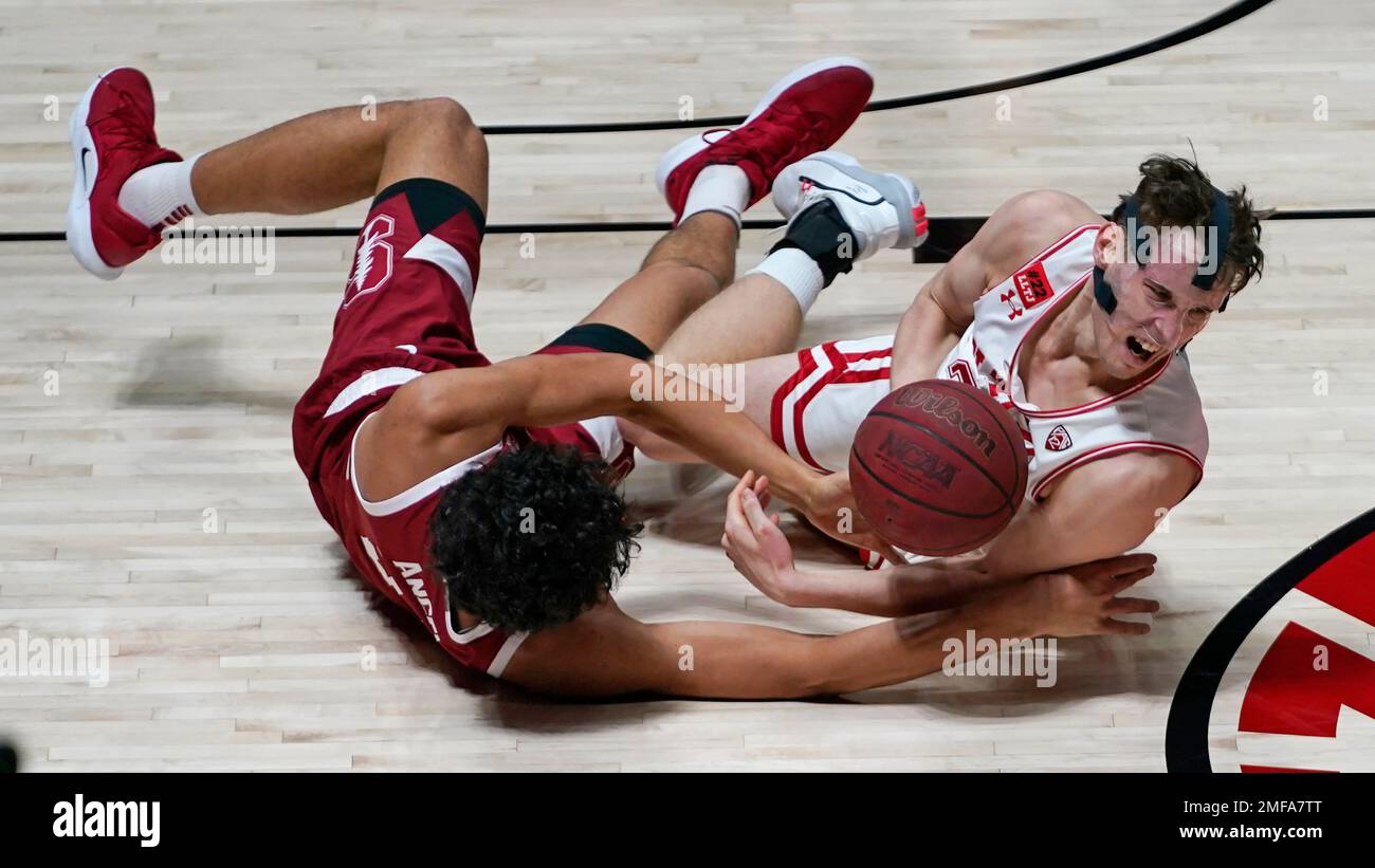 Stanford forward Brandon Angel, left, and Utah forward Mikael Jantunen ...