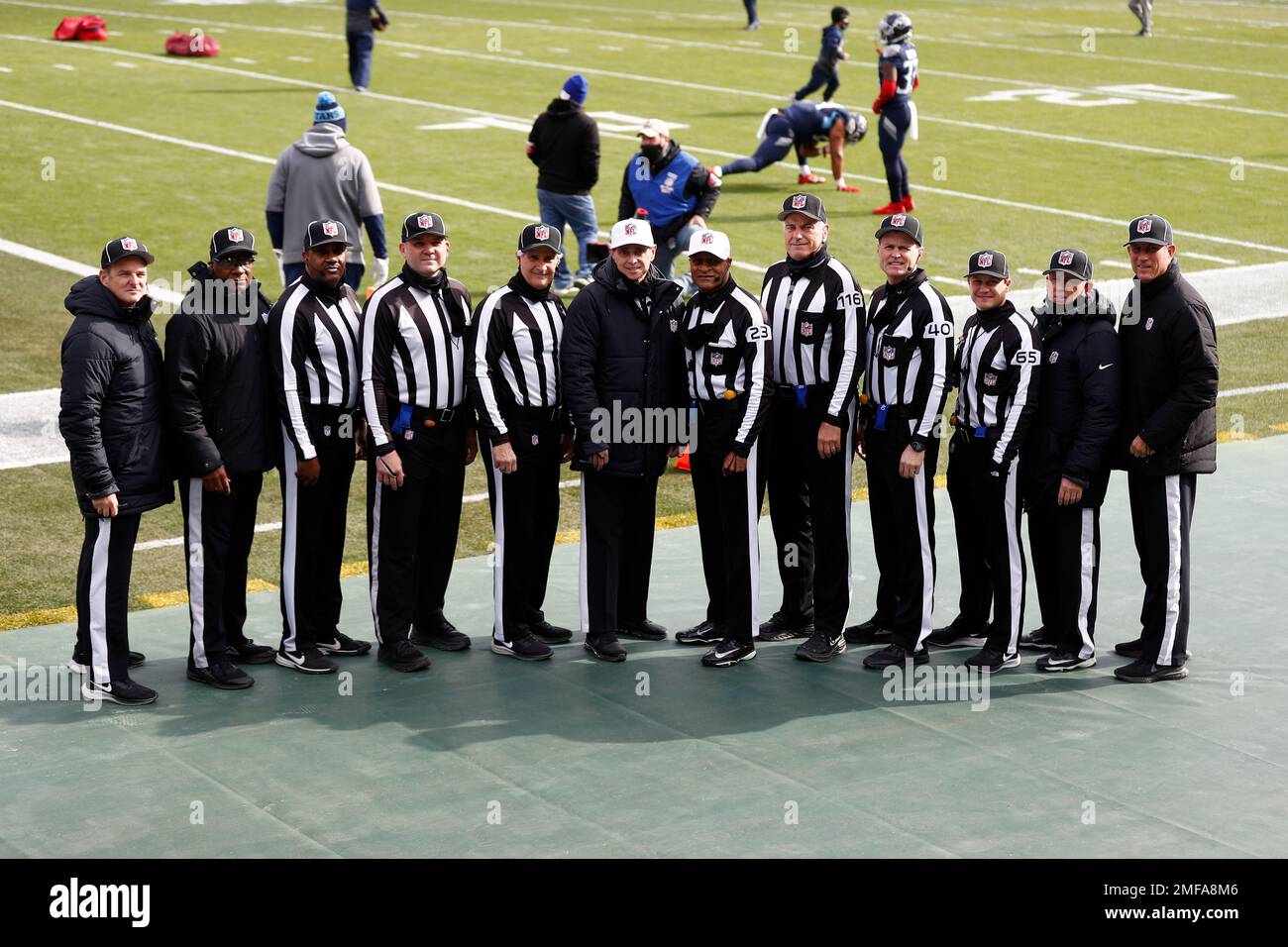 Officials pose for a portrait before an NFL wild-card playoff football ...