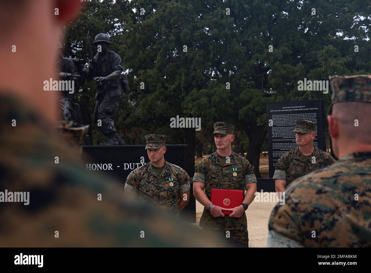 U.S. Marine Corps Staff Sgt. Dalmon Moseley, left, Staff Sgt. Dylan ...
