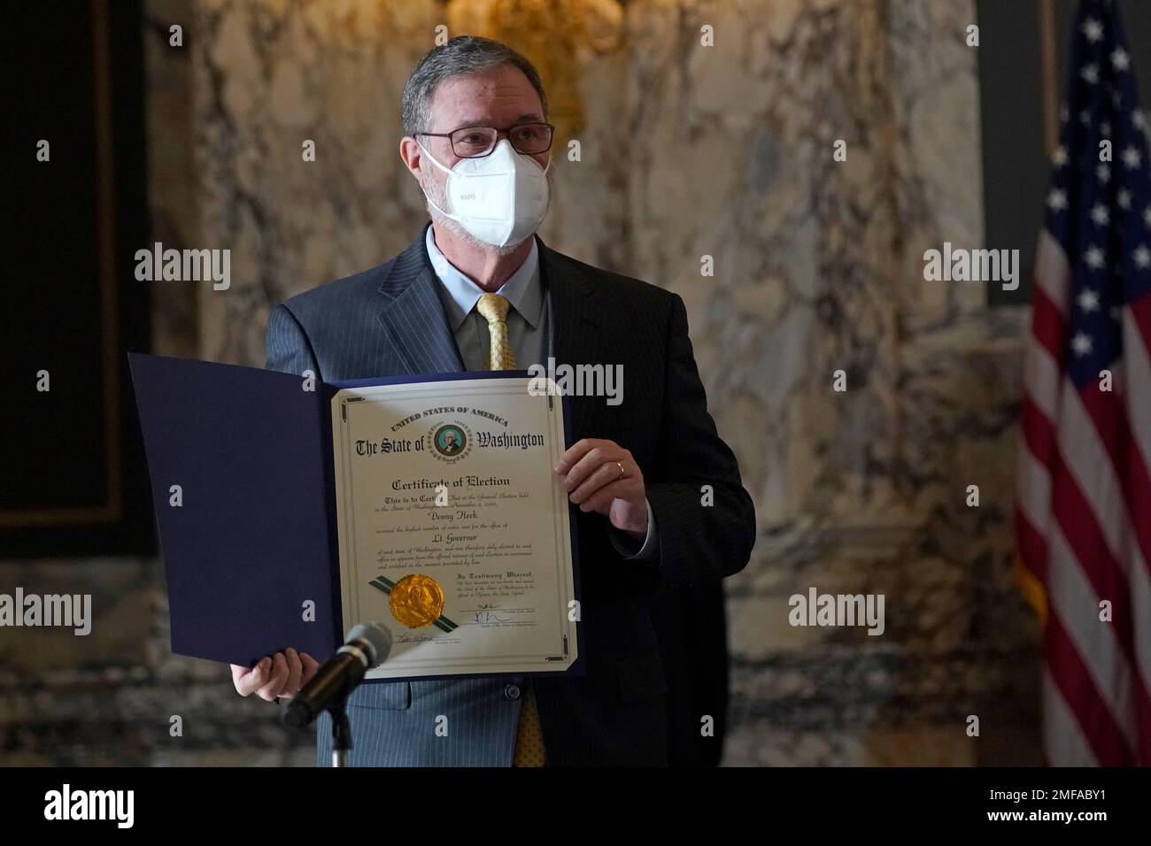 Washington Lt. Gov. Denny Heck holds his certificate of election after ...