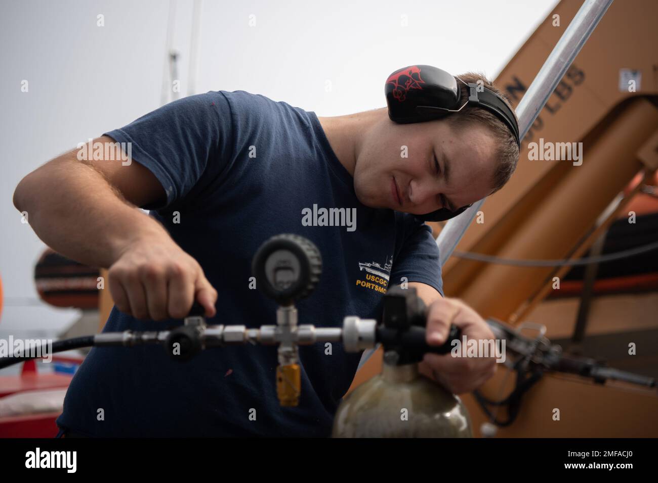 U.S. Coast Guard Petty Officer 3rd Class Doyle, a damage control man ...