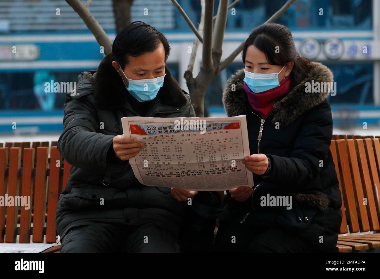 People check a newspaper in Mirae Scientists Street in Pyongyang, North ...