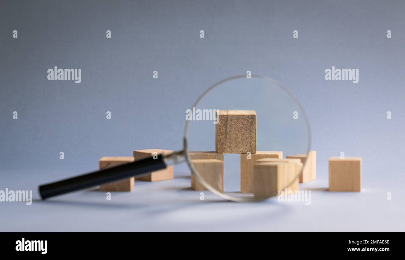 Magnifying glass wooden blocks hi-res stock photography and images - Alamy