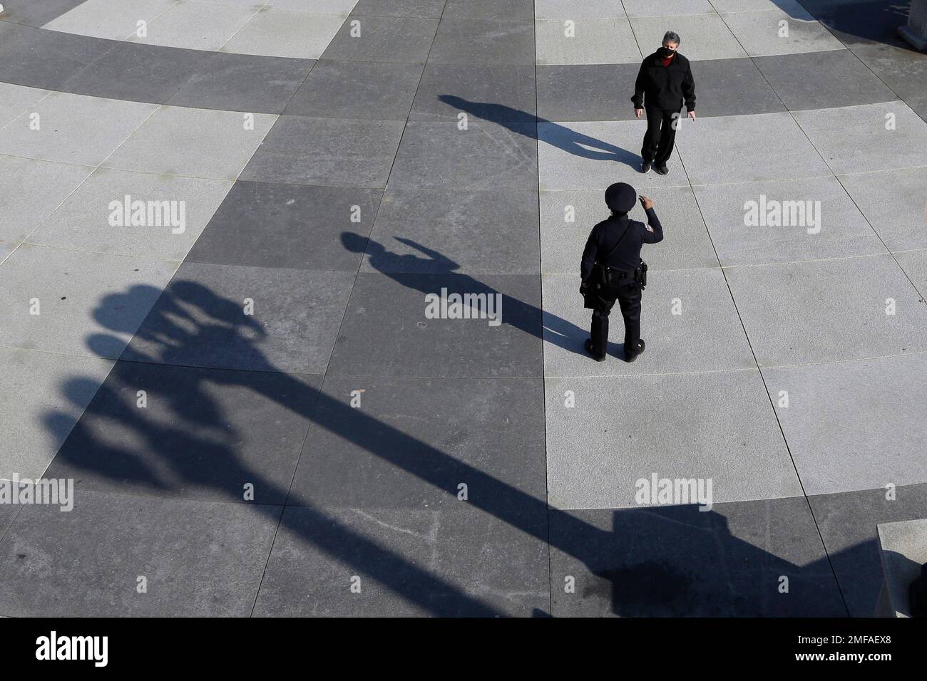 A Capitol police officer, center, talks to a Capitol police ...