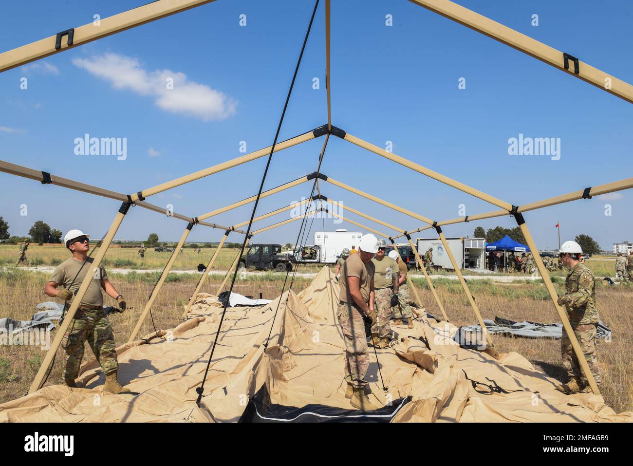 Airmen assigned to the 39th Civil Engineer Squadron assemble a tent ...