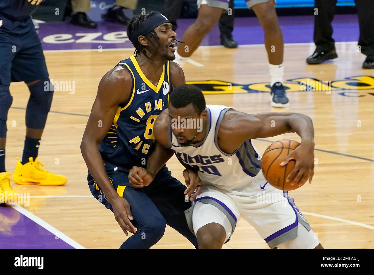 Indiana Pacers guard Justin Holiday, left, tries to stop Sacramento ...