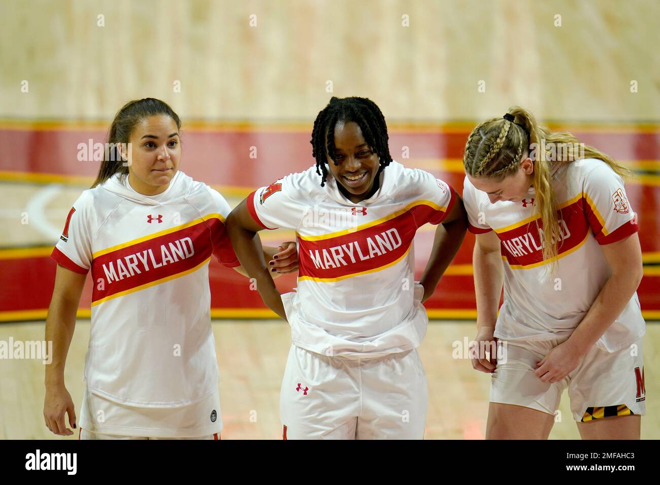 Maryland guard Katie Benzan, left, guard Channise Lewis, center, and ...