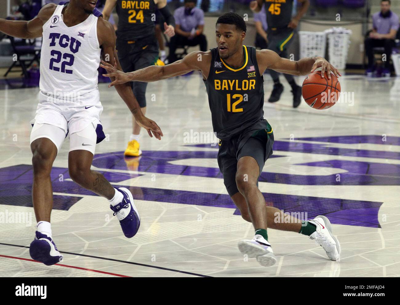 TCU guard RJ Nembhard (22) defends as Baylor guard Jared Butler (12 ...