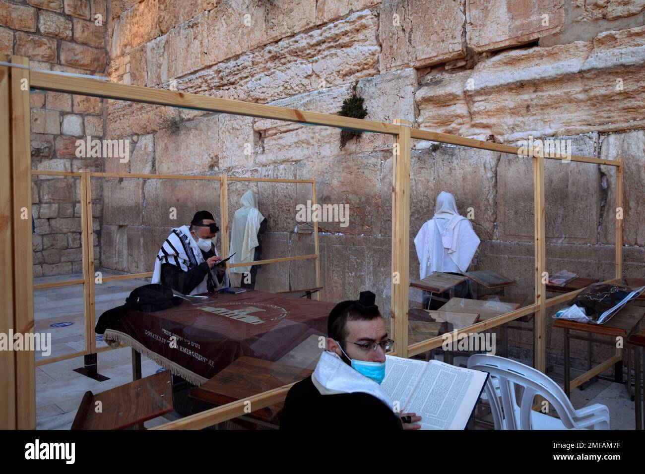 Ultra-Orthodox Jewish men pray in a divided section during nationwide ...