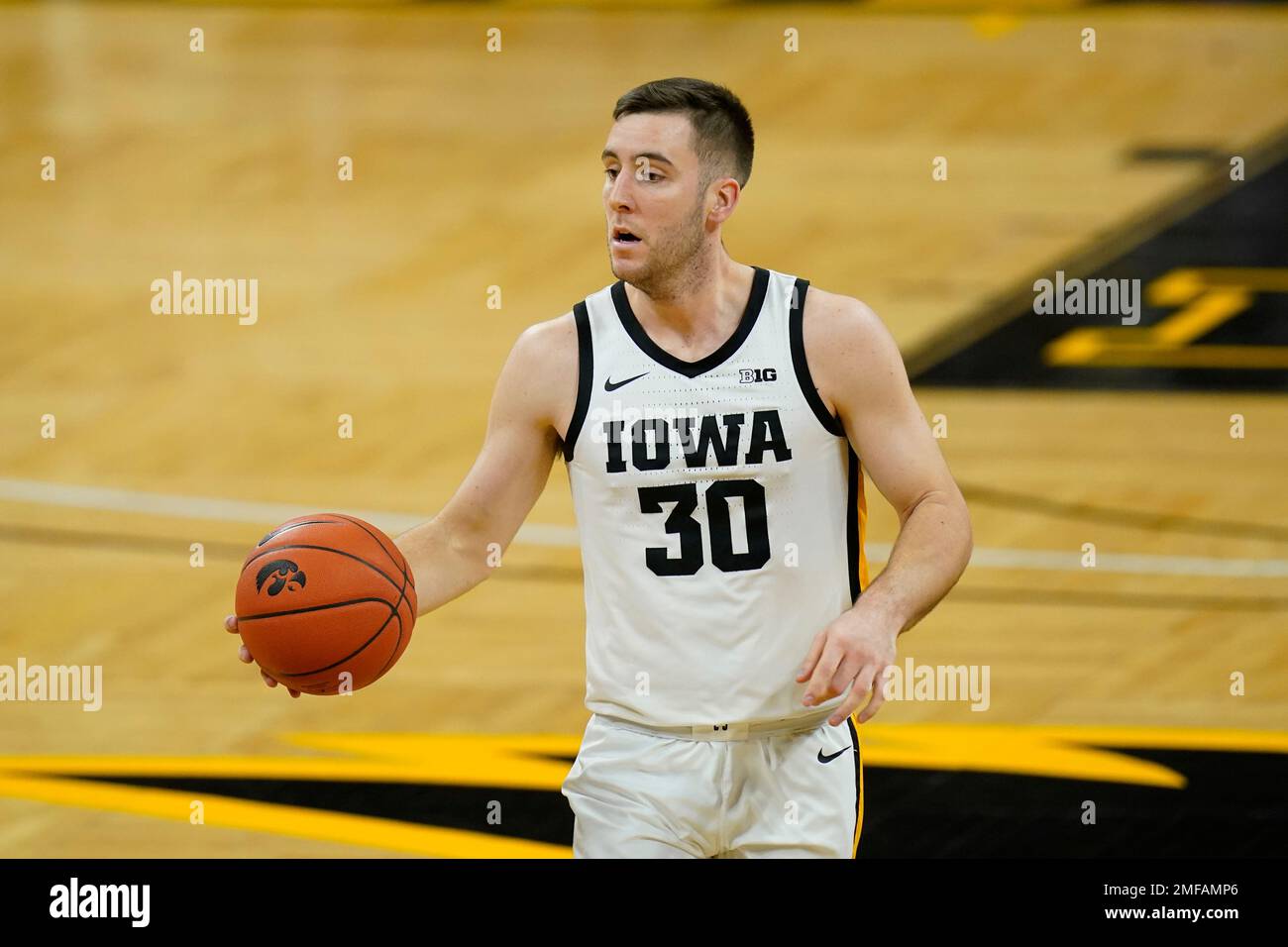 Iowa guard Connor McCaffery drives up court during the second half of ...