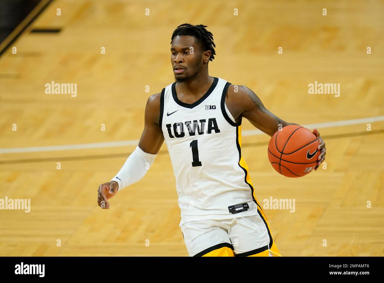 Iowa guard Joe Toussaint drives up court during the second half of an ...