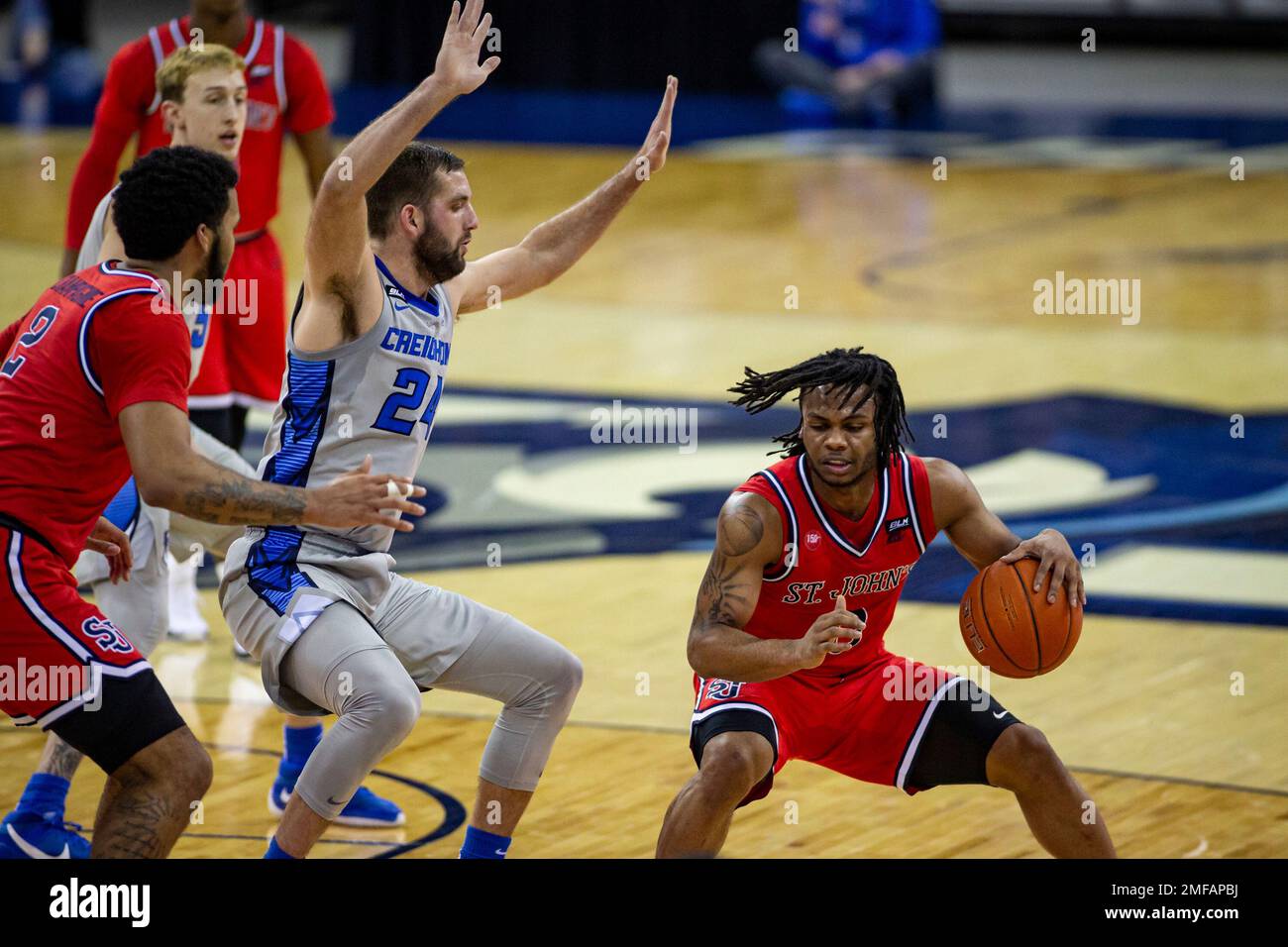 St. John's guard Posh Alexander (0) dribbles the ball against Creighton ...