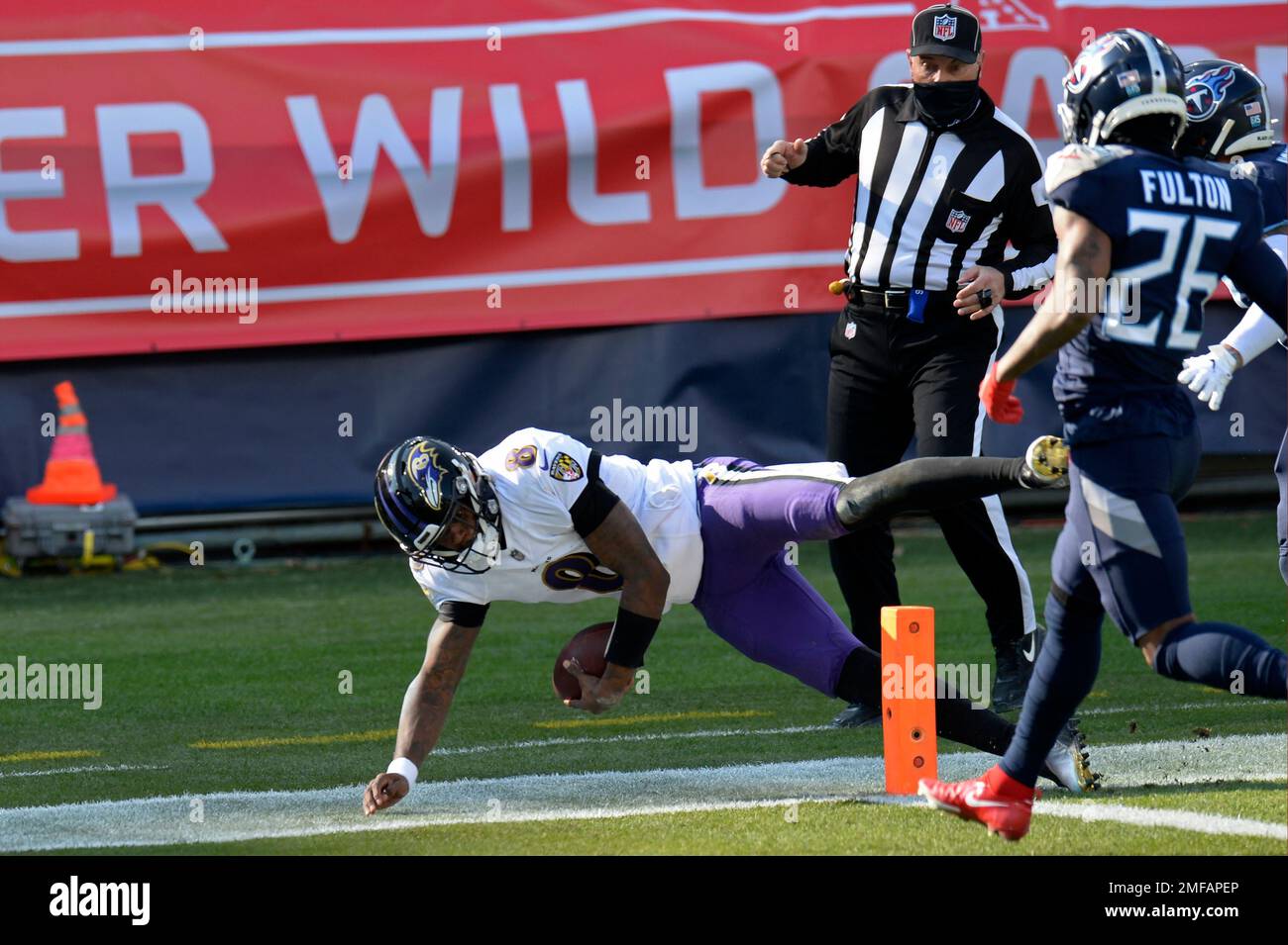 Baltimore Ravens quarterback Lamar Jackson (8) scores a touchdown on a ...