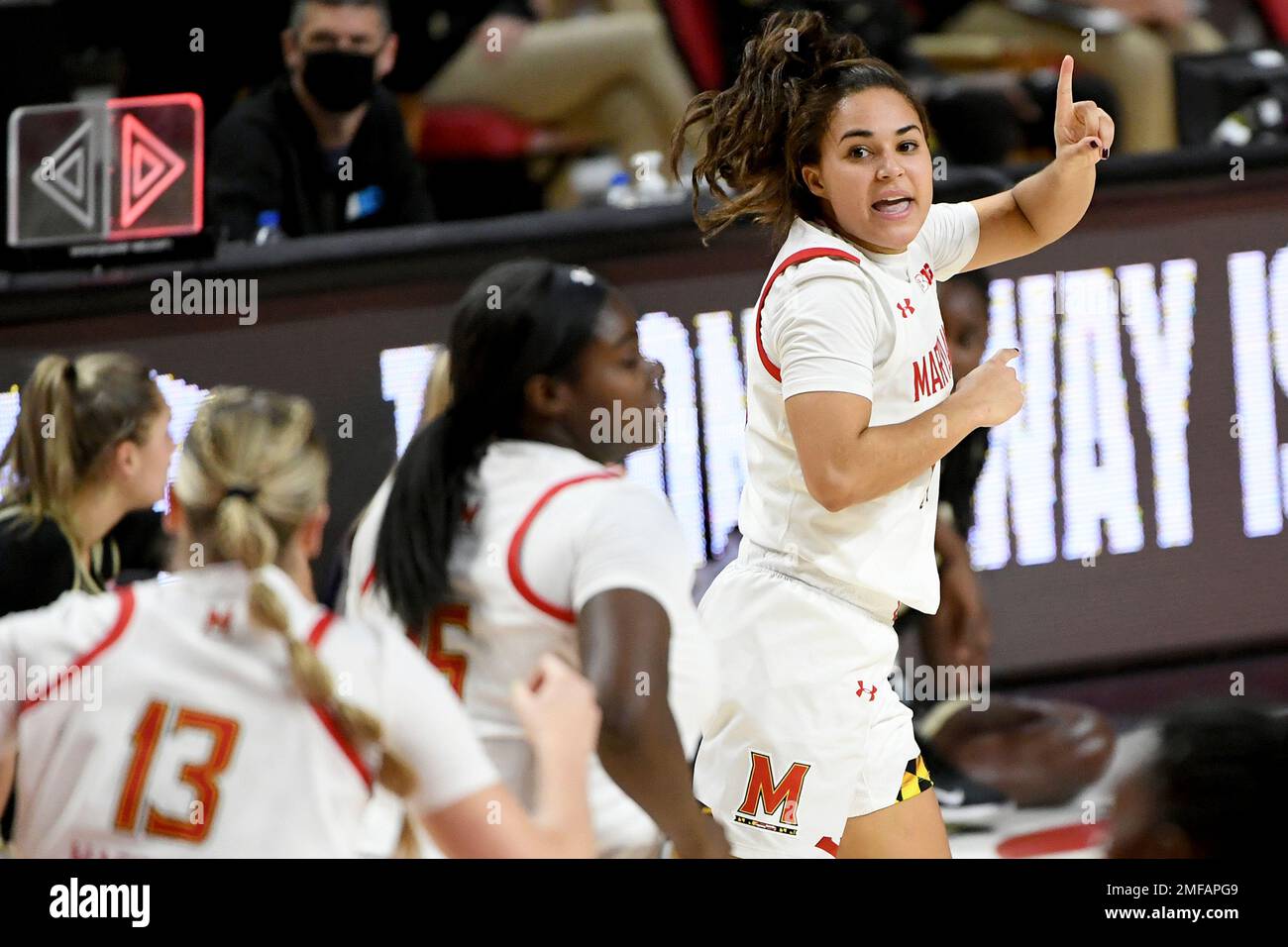Maryland guard Katie Benzan (11) celebrates after a play against the ...