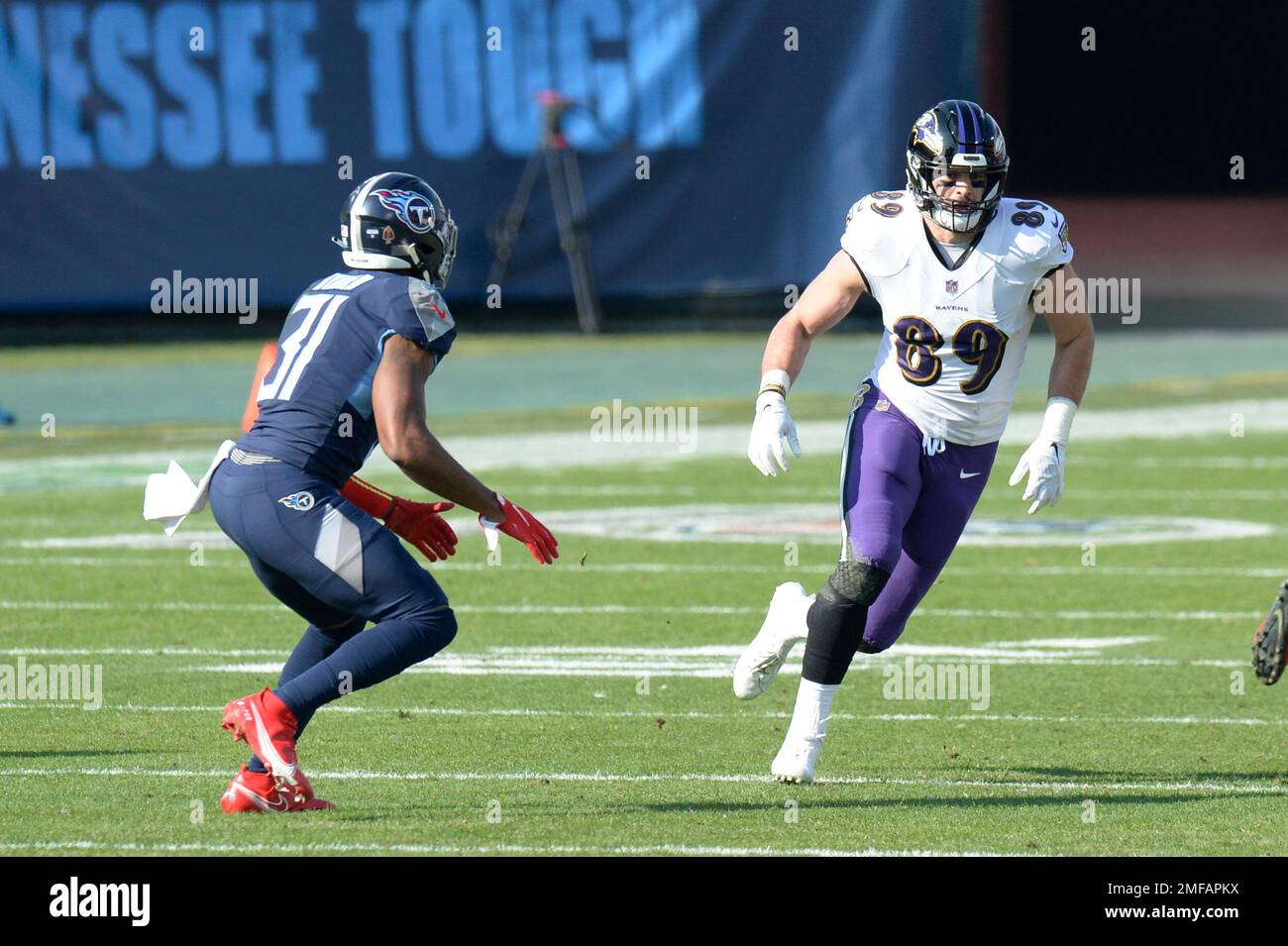 Baltimore Ravens tight end Mark Andrews (89) is defended by Tennessee ...
