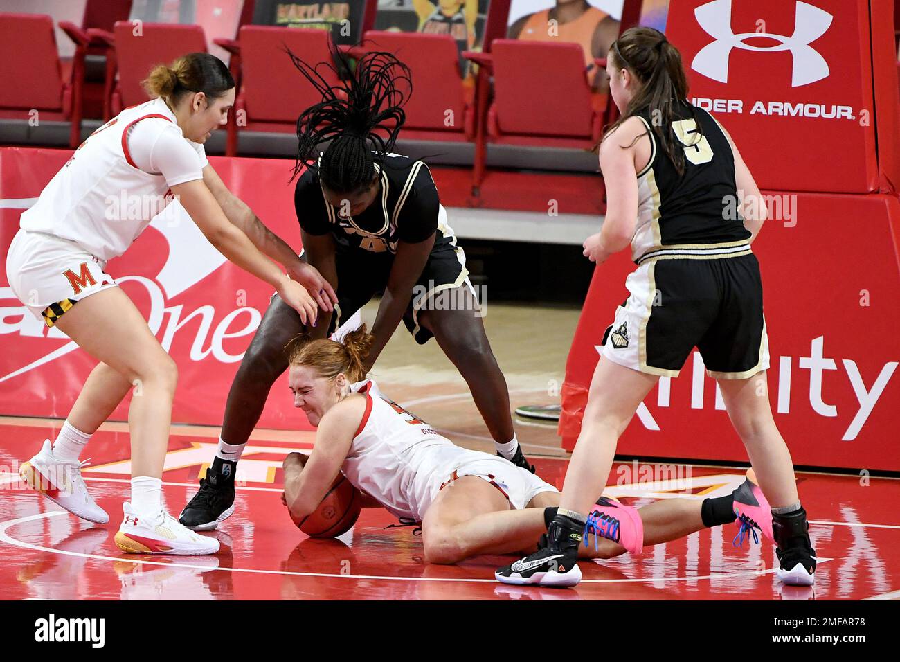 Maryland forward Chloe Bibby (55) dives on the ball in front of Purdue ...