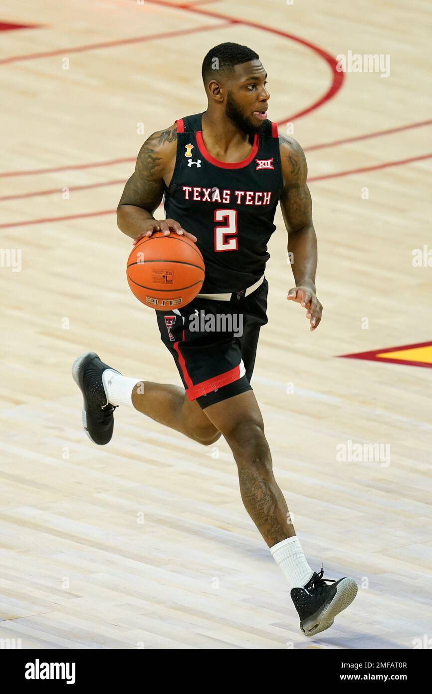 Texas Tech guard Jamarius Burton drives up court during the first half ...