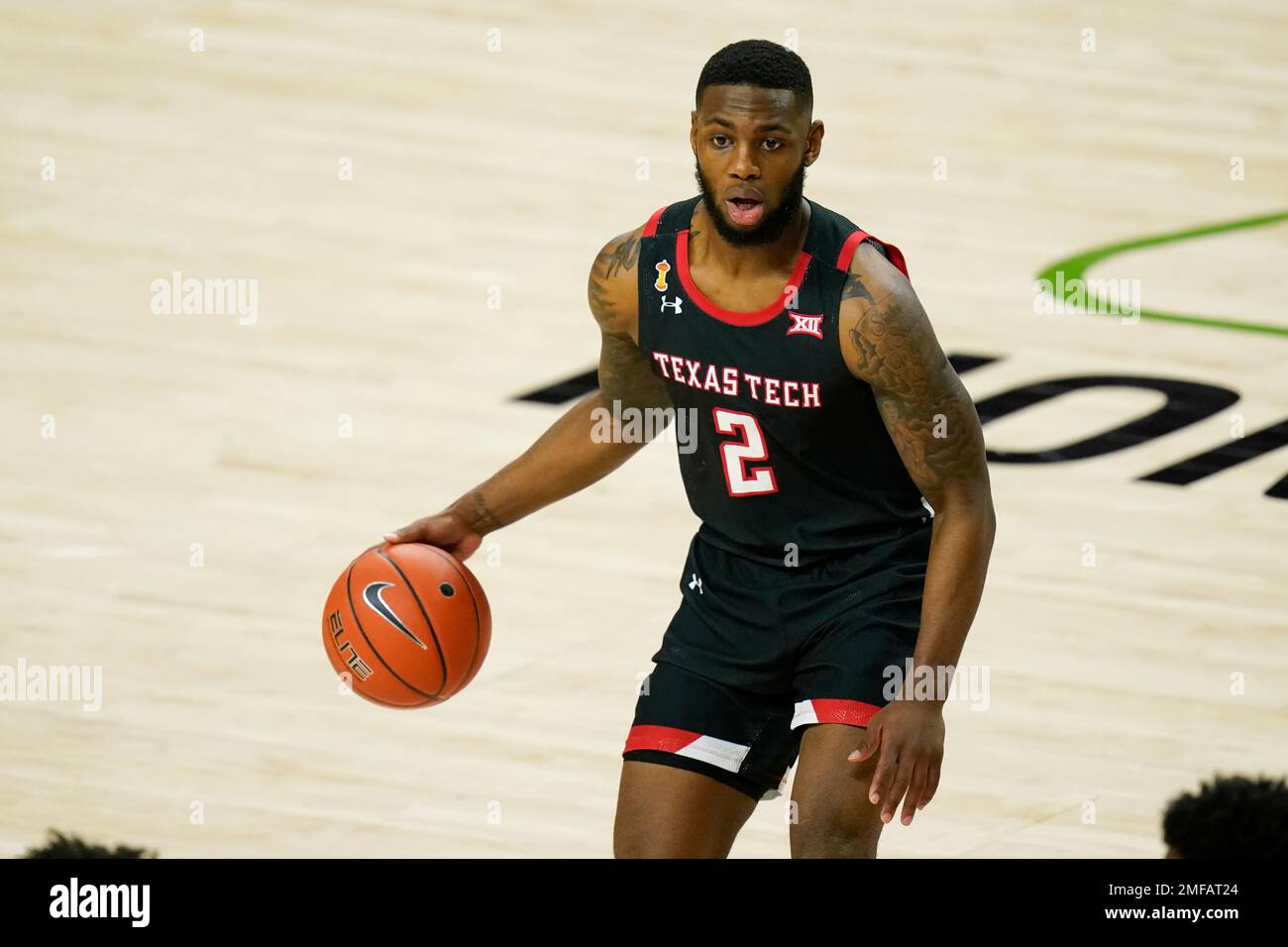 Texas Tech guard Jamarius Burton looks to pass during the first half of ...