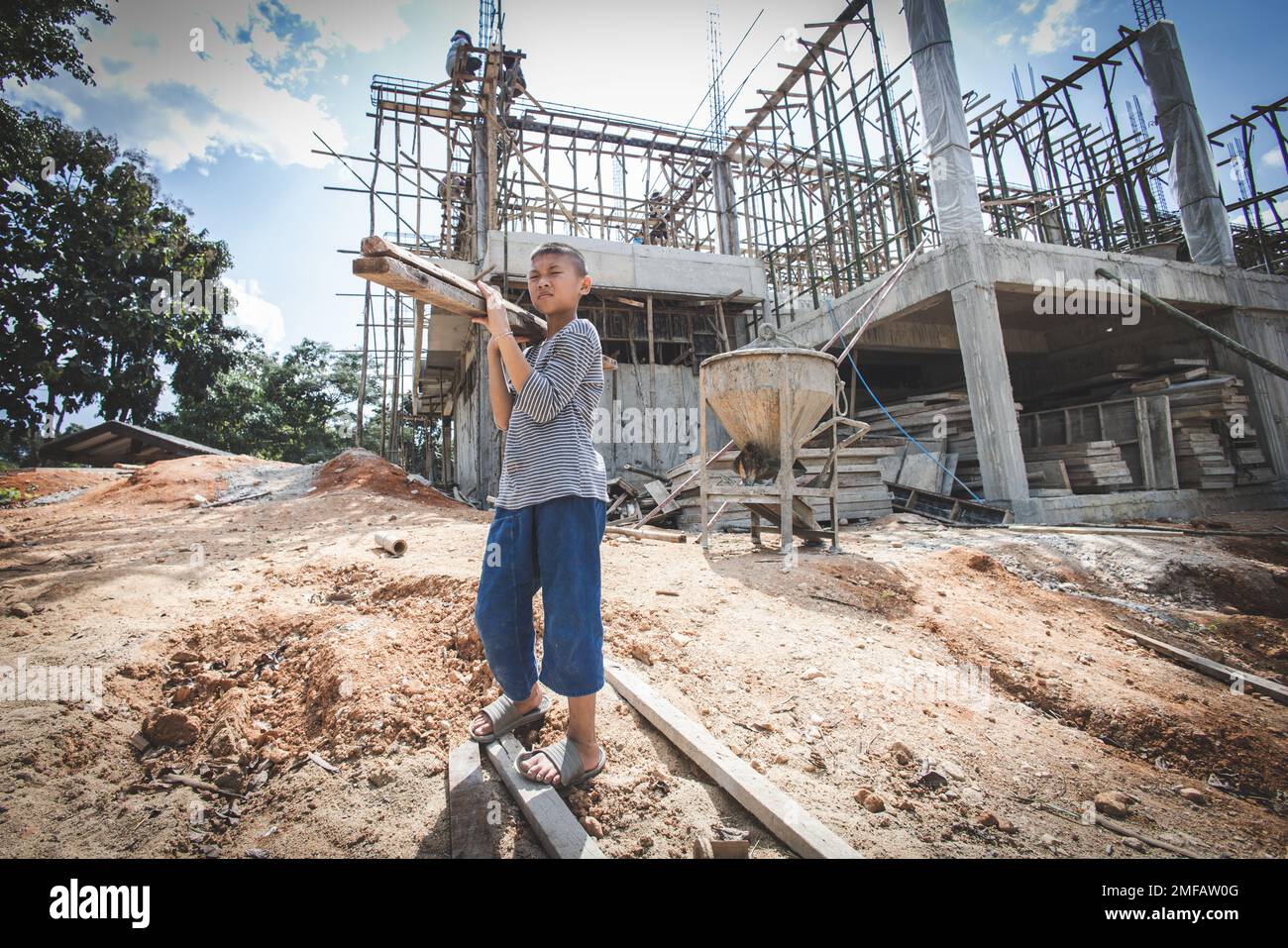 Children violence and abused concept. Little boy labor working in ...