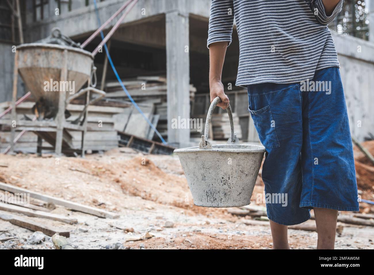 Children violence and abused concept. Little boy labor working in ...