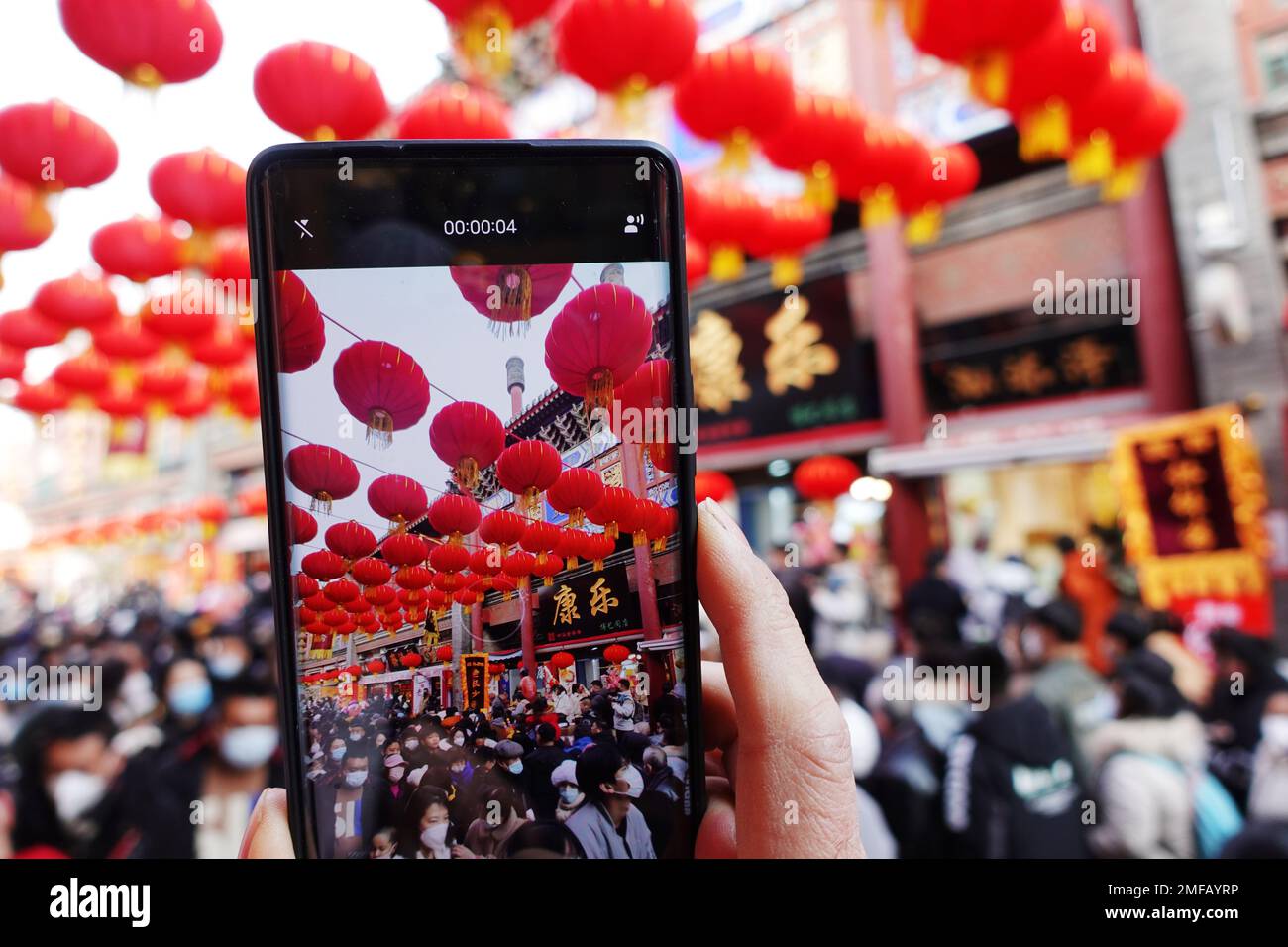 Crowded people in a temple fair to celebrate traditional Chinese Spring ...