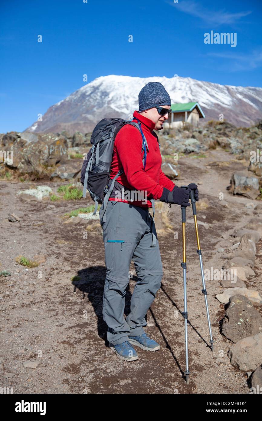 Male backpacker on the trek to Kilimanjaro mountain Stock Photo - Alamy