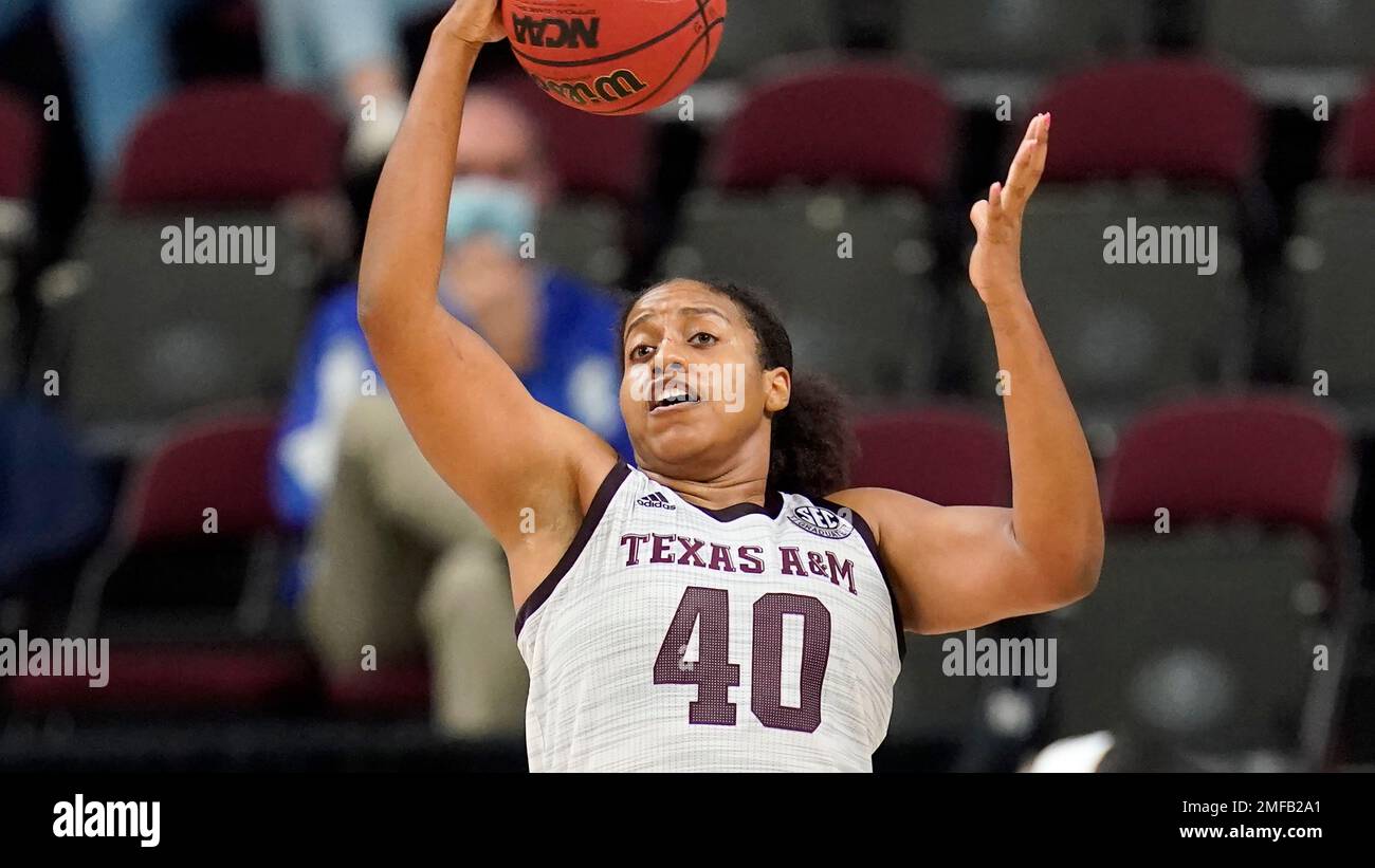 Texas A&M center Ciera Johnson (40) pulls down a rebound against ...