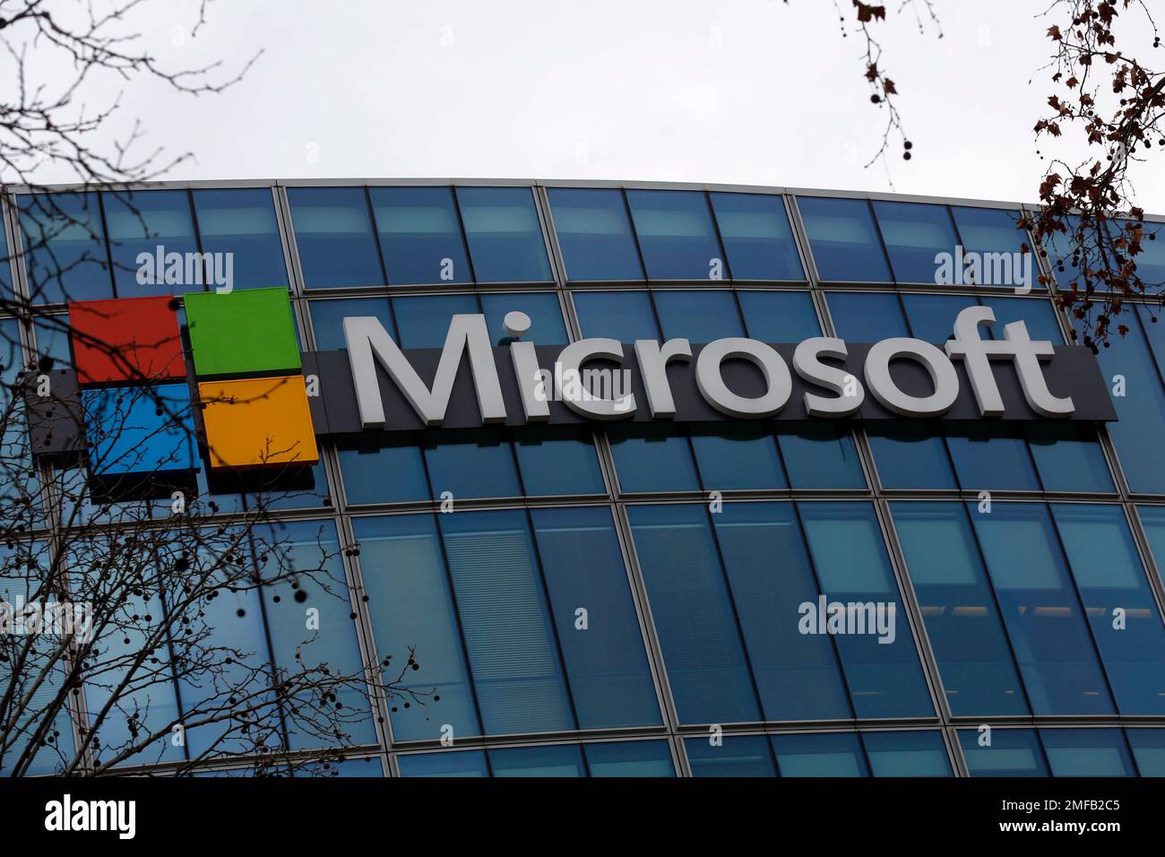 The logo of Microsoft is displayed outside the headquarters, in Paris ...