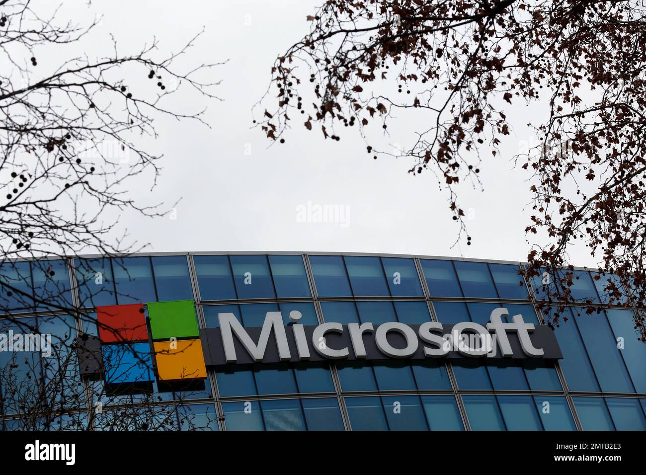 The logo of Microsoft is displayed outside the headquarters, in Paris ...