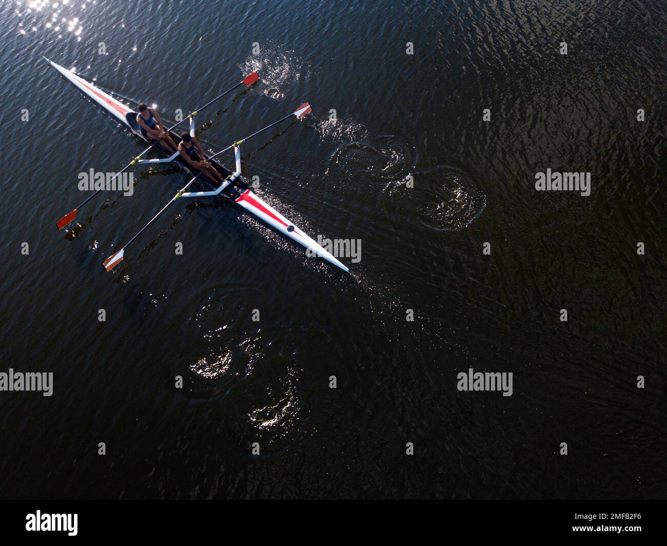 Rowers move across the Bay of Asuncion, Paraguay, early Friday, Jan. 8 ...