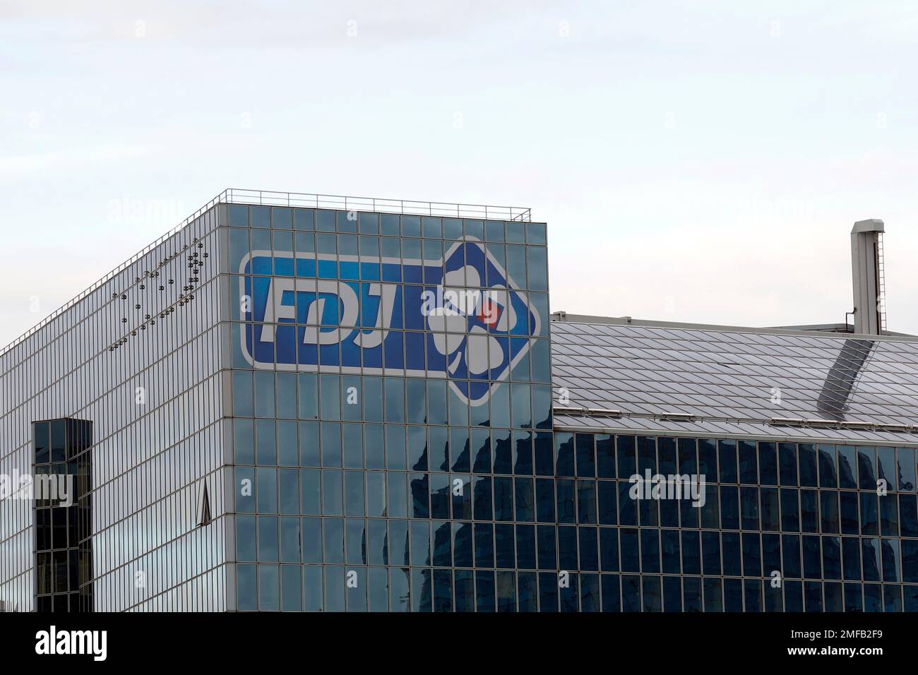 The logo of the FDJ (Francaise des Jeux) group is displayed outside the ...