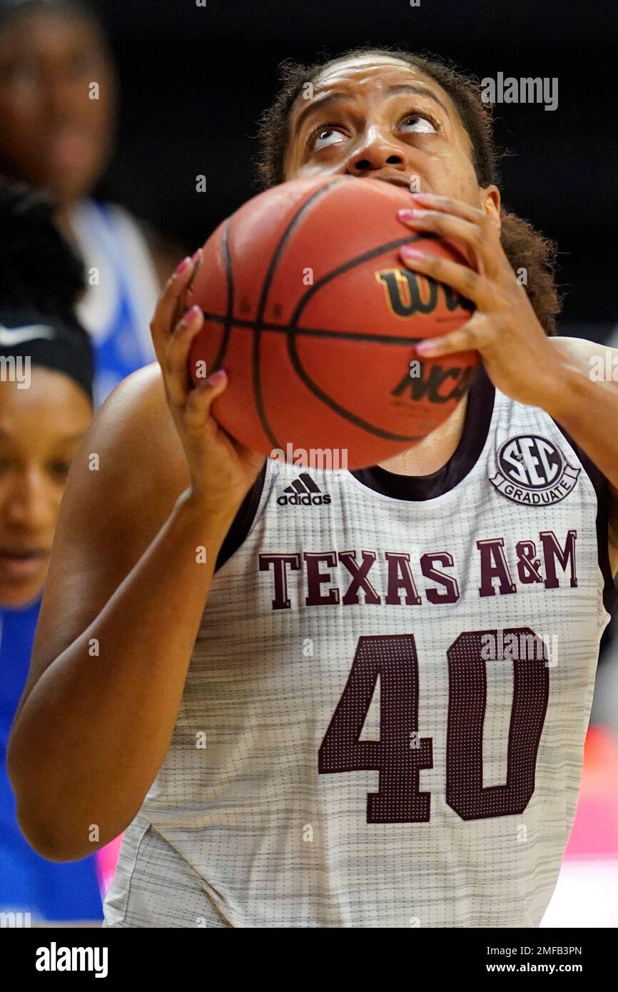 Texas A&M center Ciera Johnson (40) shoots against Kentucky during the ...