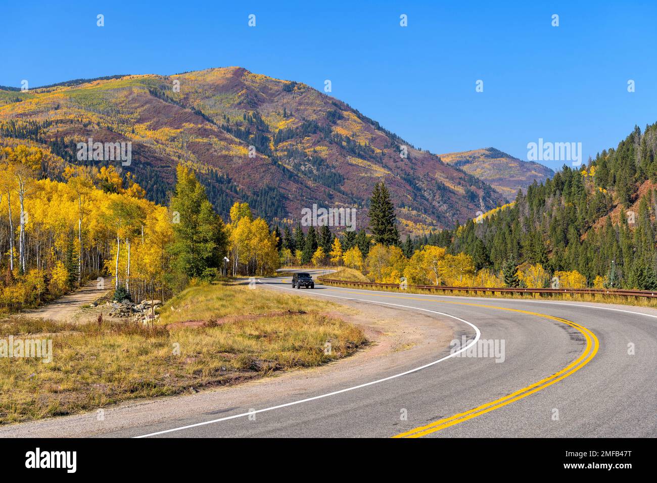 Autumn Mountain Road - A colorful Autumn view of a big and sharp ...