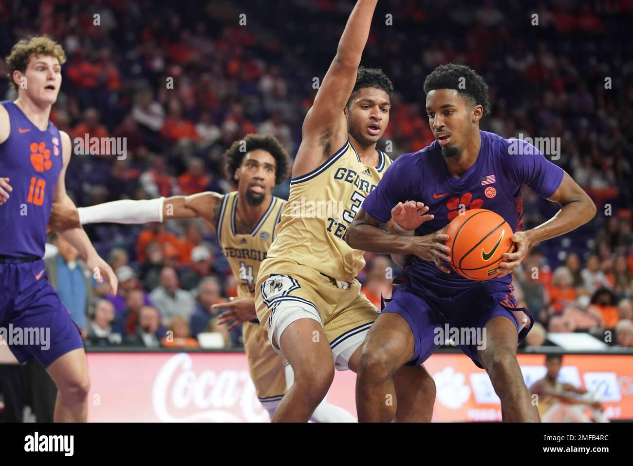 Clemson forward Chauncey Wiggins (21) drives against Georgia Tech guard ...