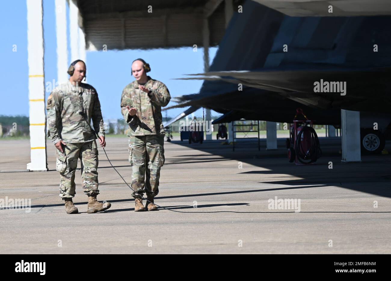 U.S. Air Force Staff Sgt. Aaron Rowe, left, 1st Munitions Squadron ...