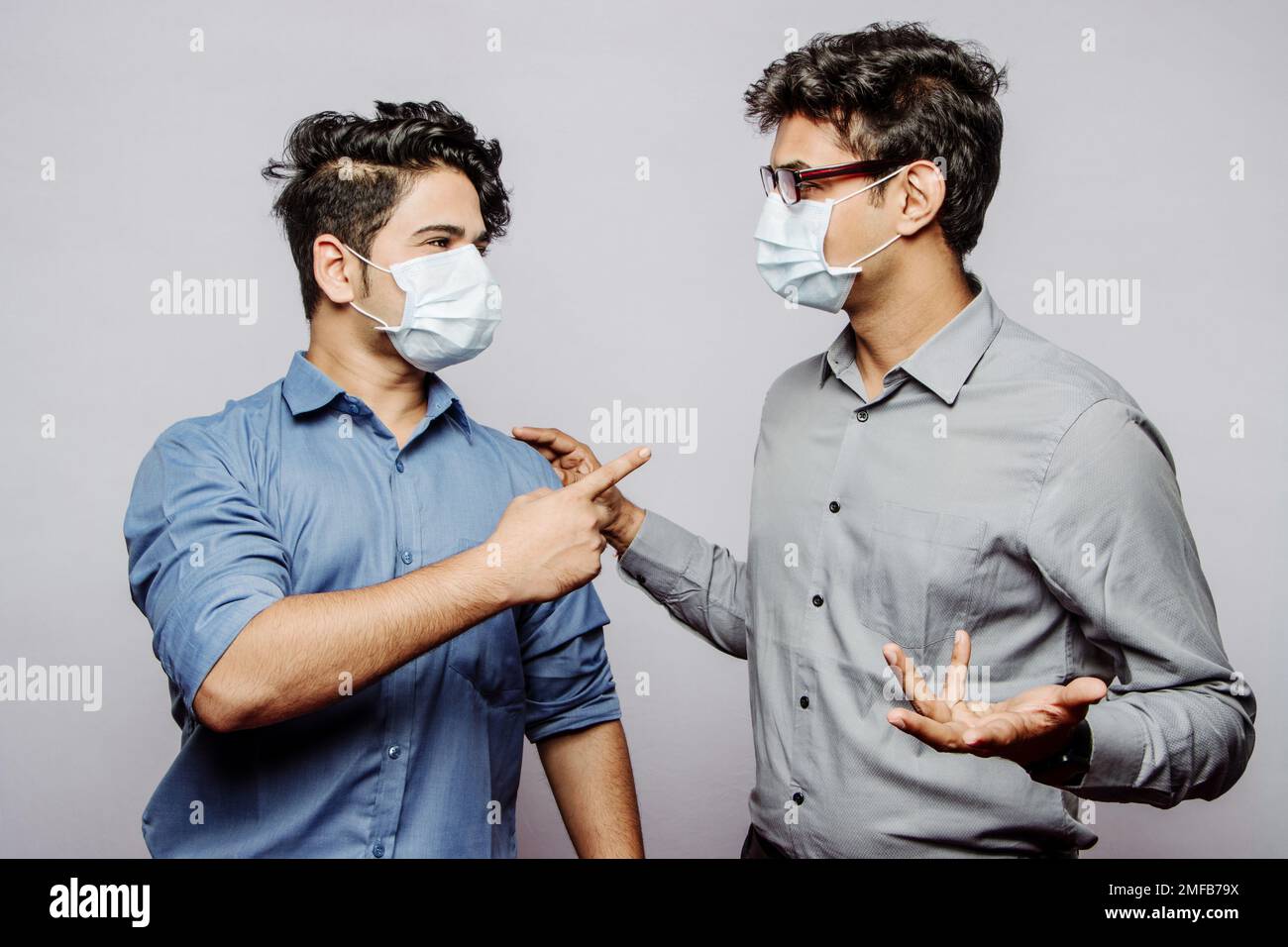 Candid shot of happy successful business partner wearing mask and ...