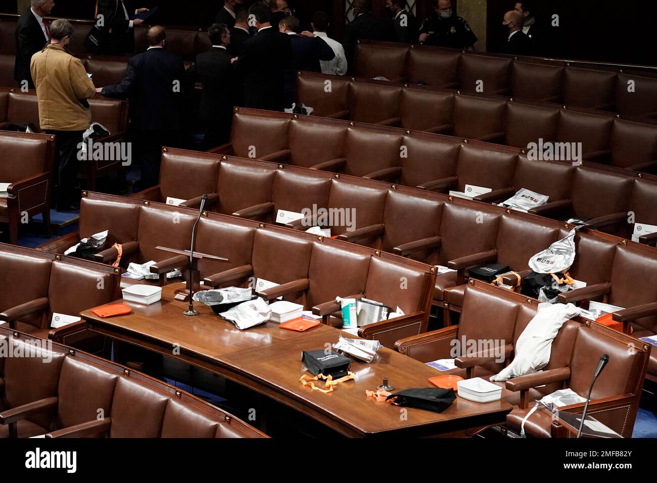 Lawmakers prepare to evacuate the floor as rioters try to break into ...