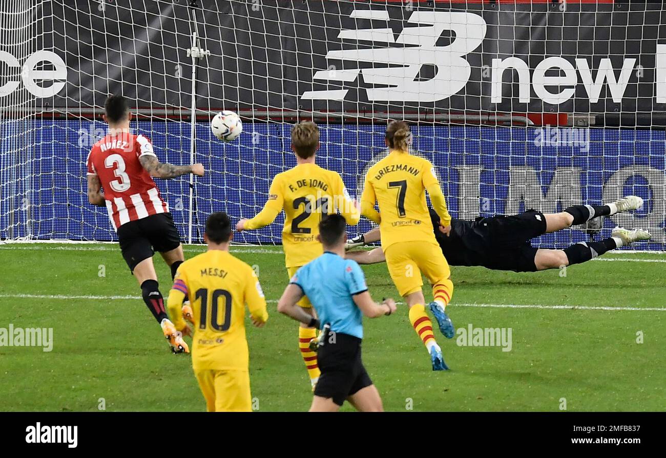 Athletic Bilbao's goalkeeper Unai Simon, saves the ball during the ...