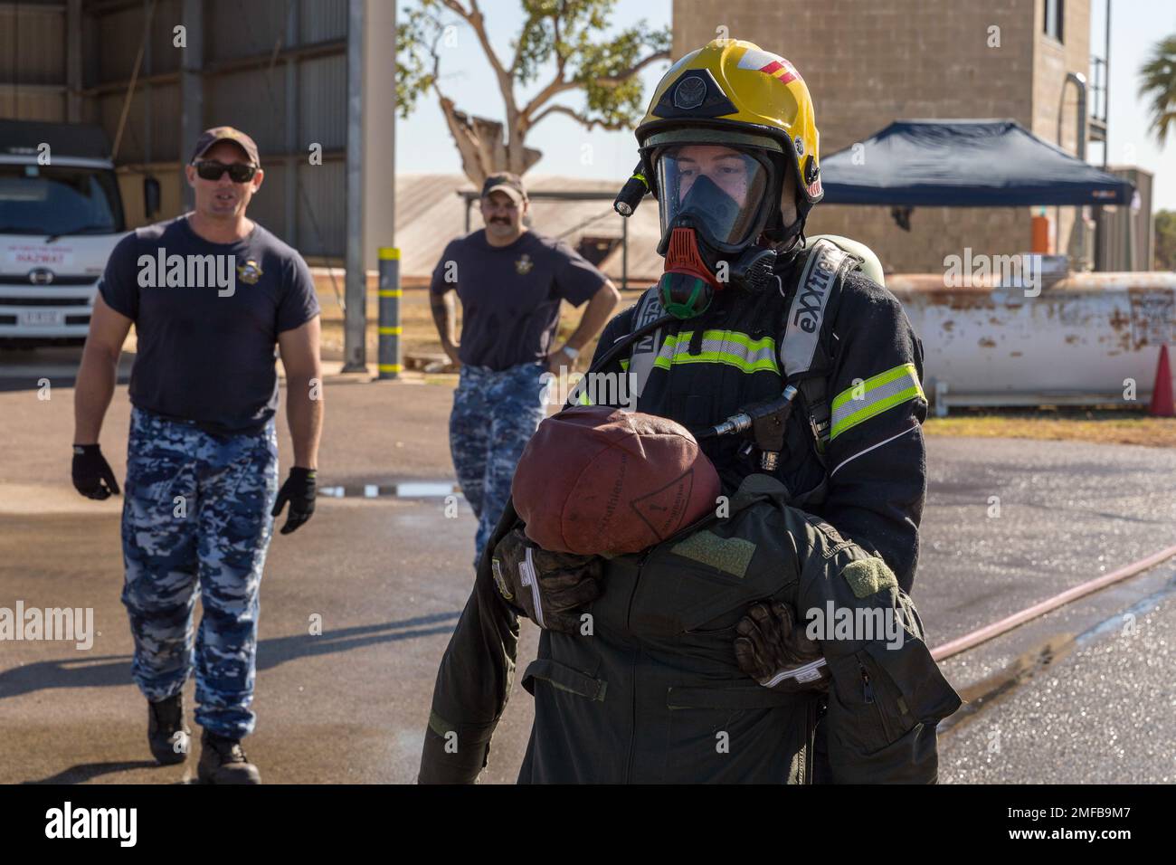 Royal New Zealand Air Force (RNZAF) Flt. Lt. Kelsey May carries a ...