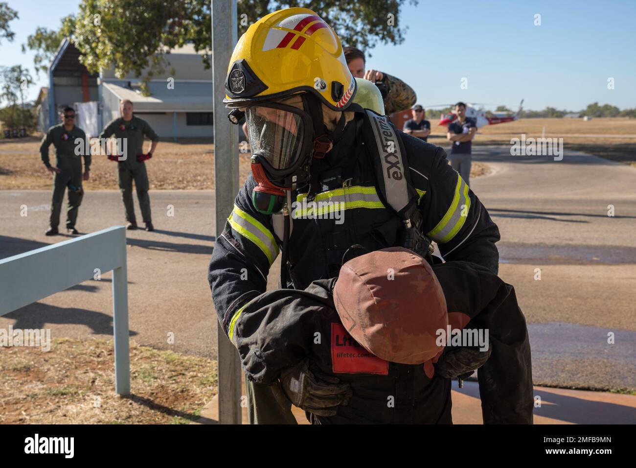 Royal New Zealand Air Force (RNZAF) LAC. Jamie Hepworth, a firefighter ...