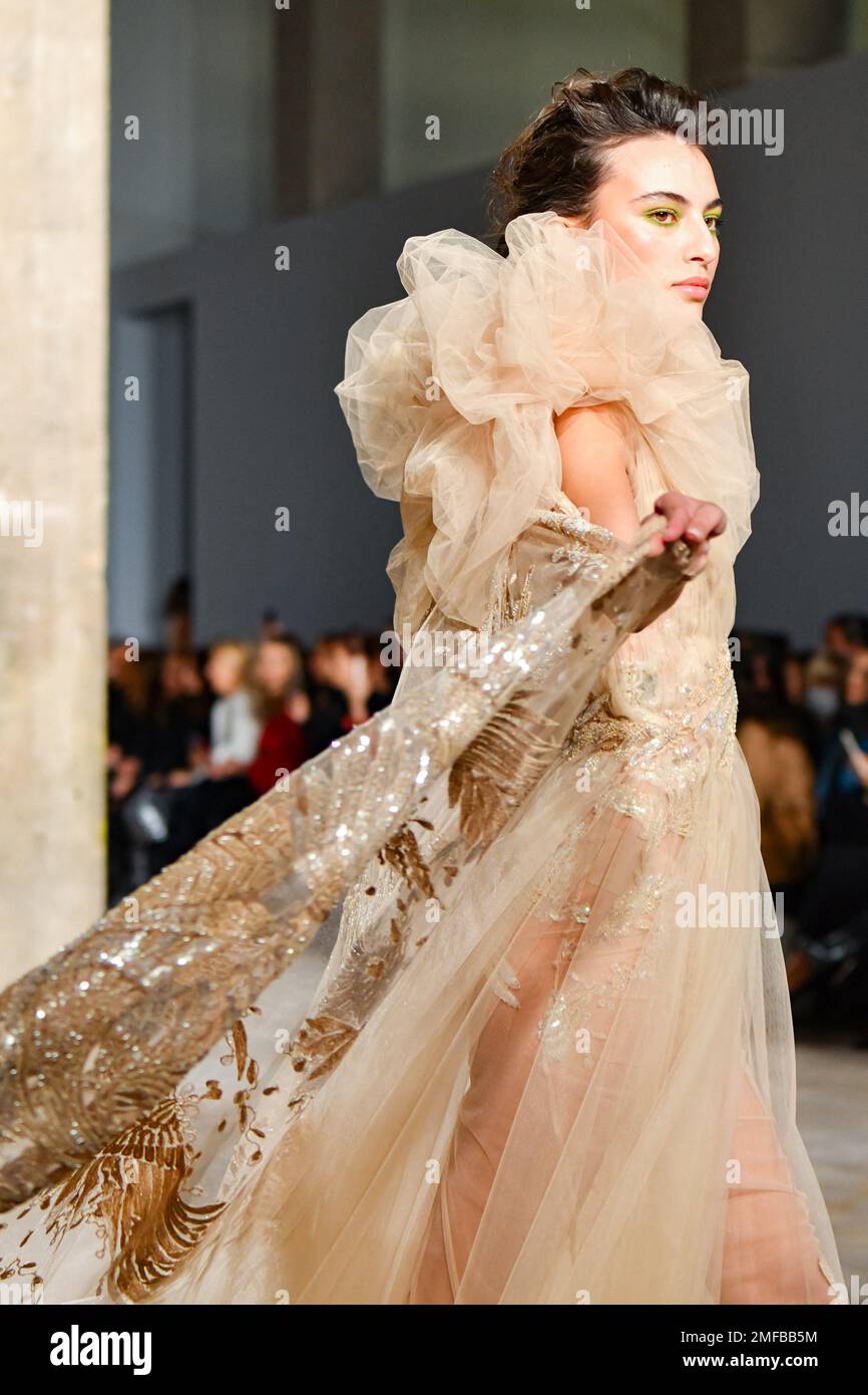 A model walks the runway at the Georges Chakra Haute Couture Spring ...