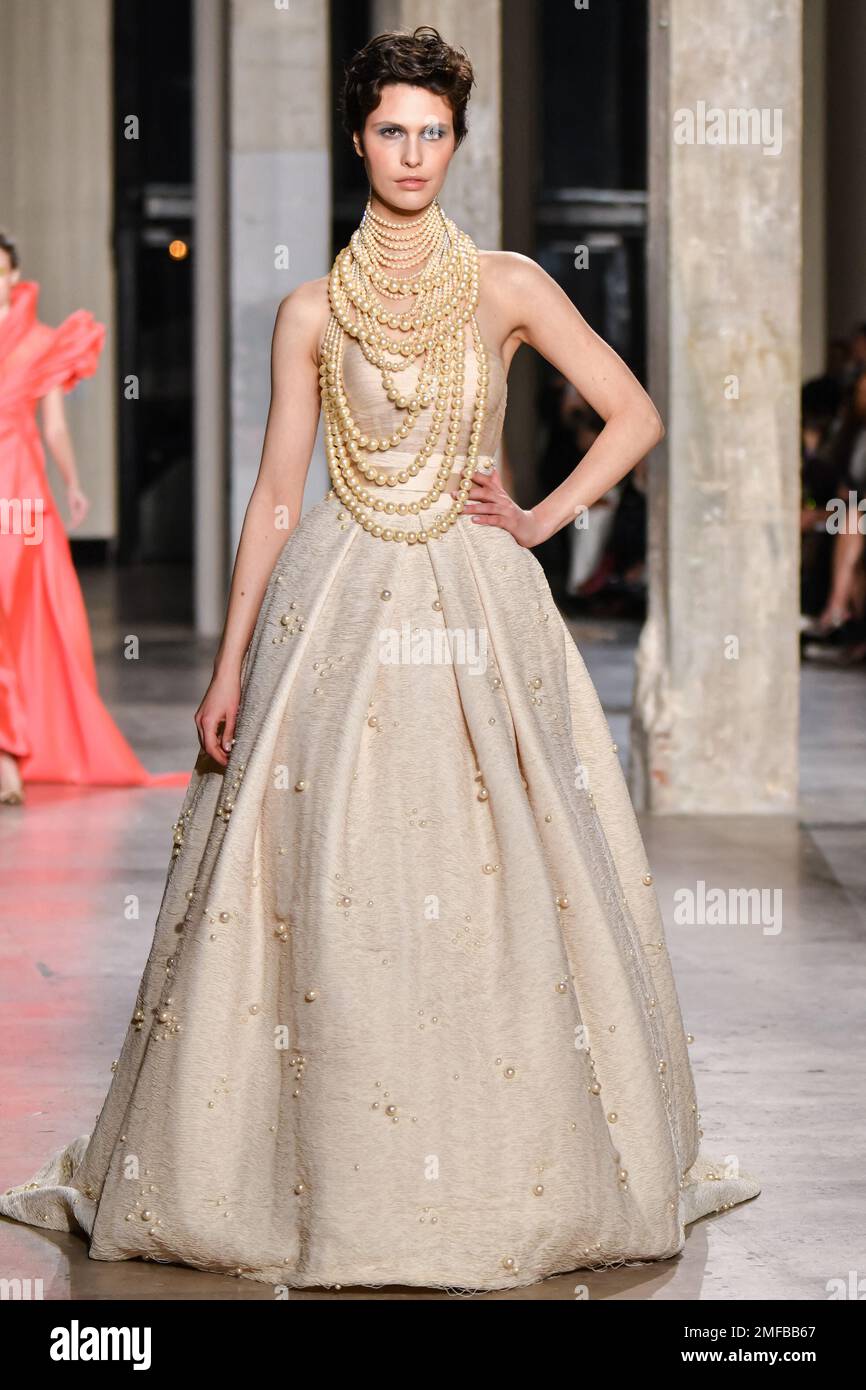 A model walks the runway at the Georges Chakra Haute Couture Spring ...