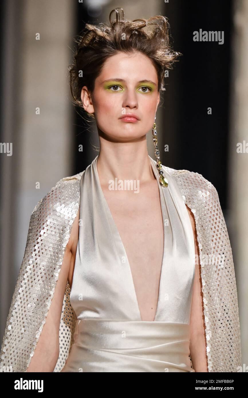 A model walks the runway at the Georges Chakra Haute Couture Spring ...