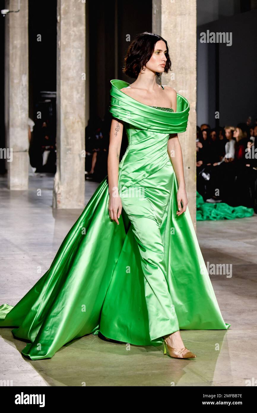 A model walks the runway at the Georges Chakra Haute Couture Spring ...