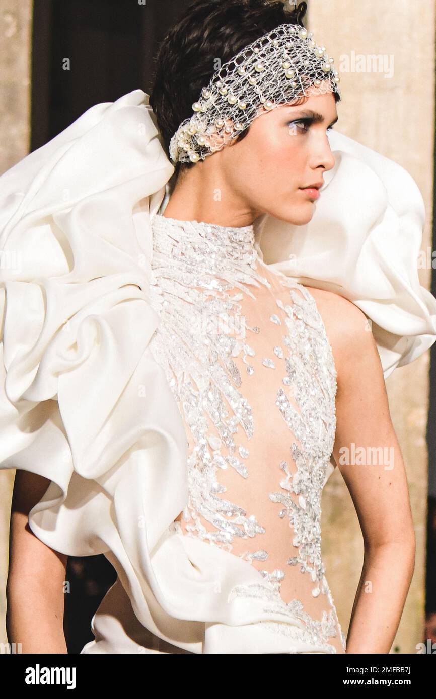 A model walks the runway at the Georges Chakra Haute Couture Spring ...