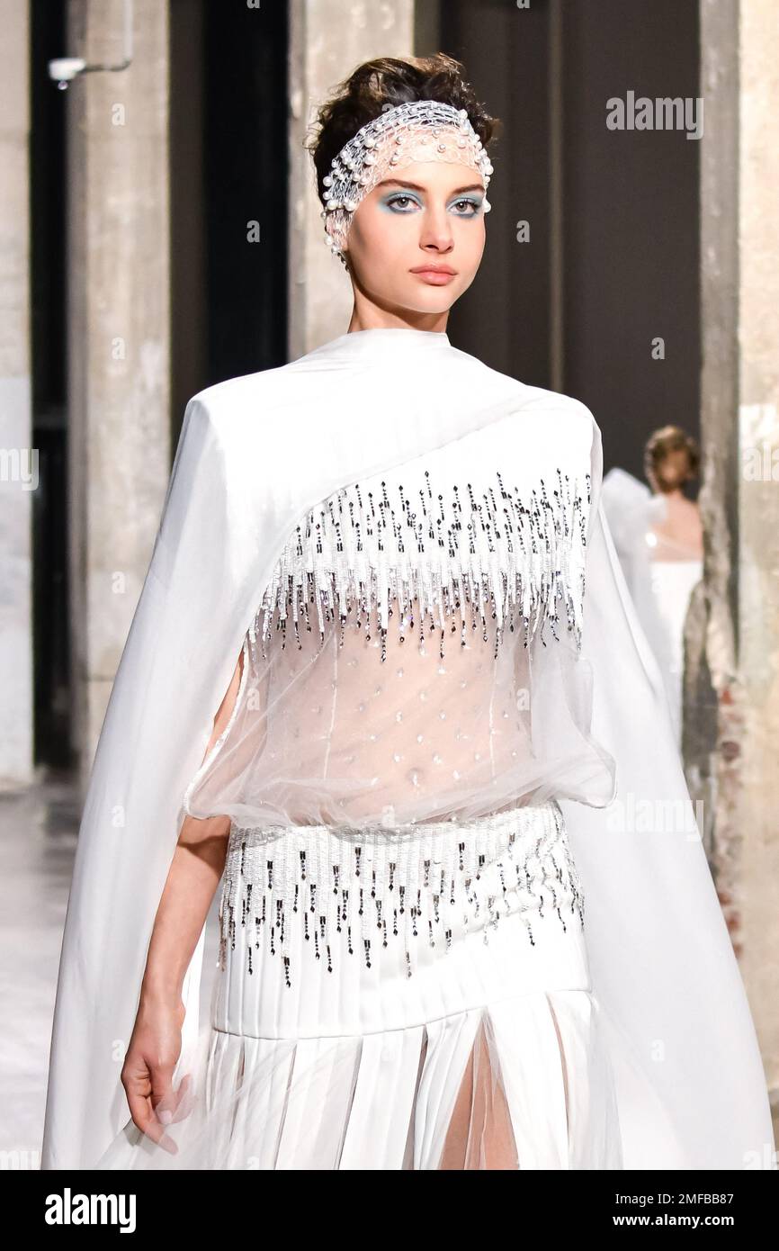 A model walks the runway at the Georges Chakra Haute Couture Spring ...