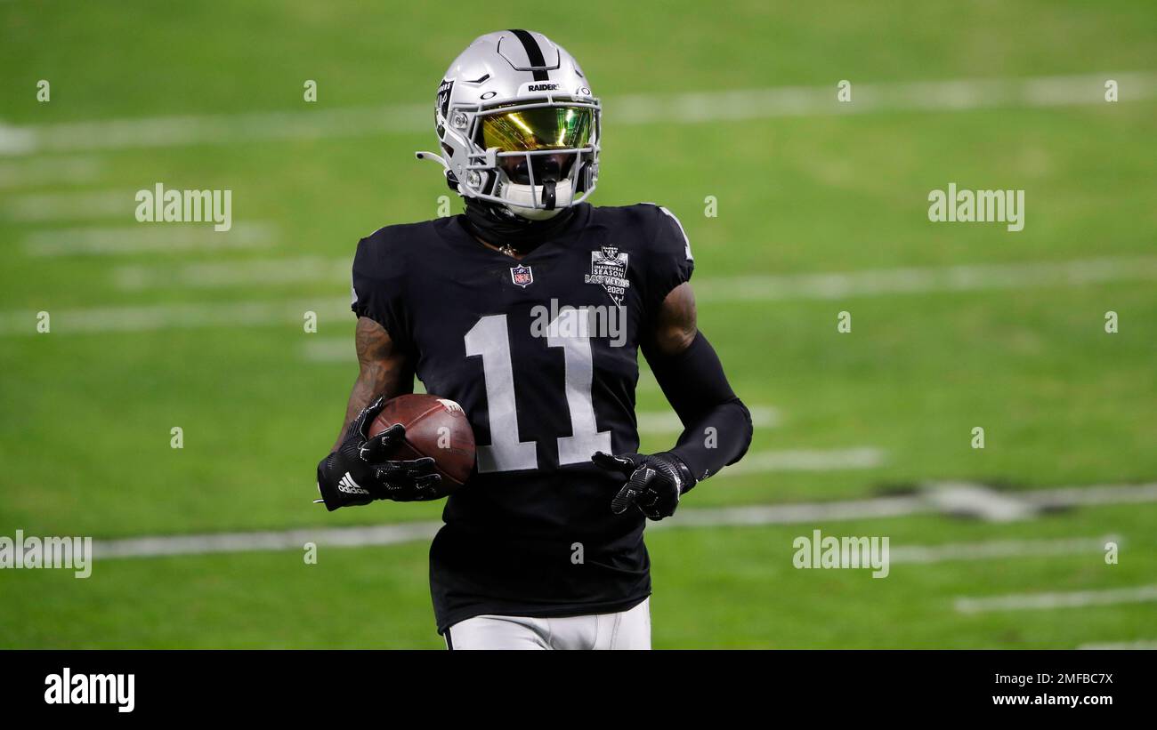 Las Vegas Raiders wide receiver Henry Ruggs III (11) warms up before an ...